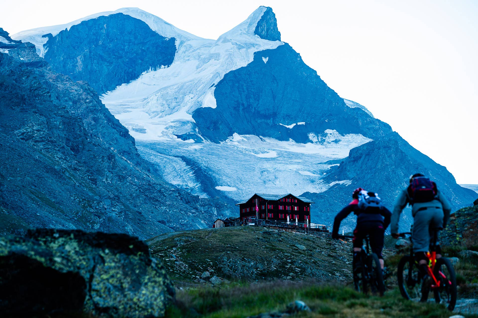 Captivating Photos: Mountain Biking Amidst Snow-Capped Peaks and ...