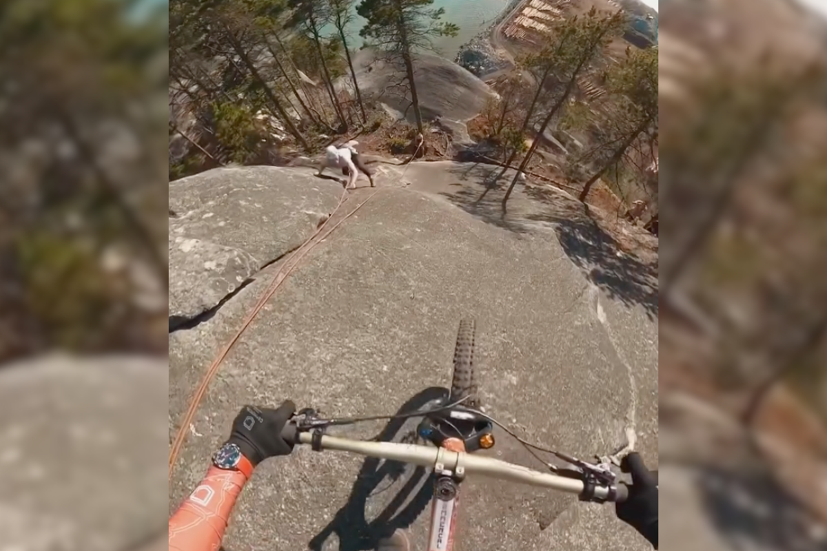 Mountain Biker Sneaks By Rock Climber On Steep Trail