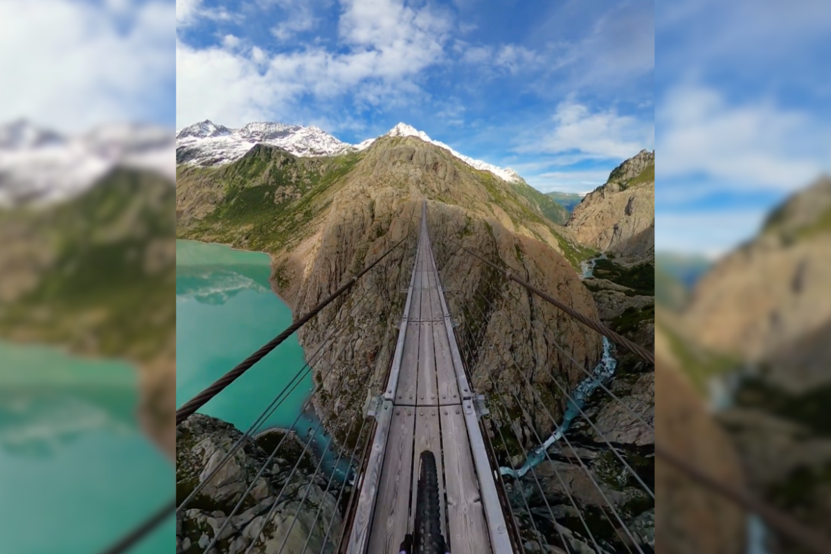 Video: Biking Across A Stunning Suspension Bridge On One Wheel