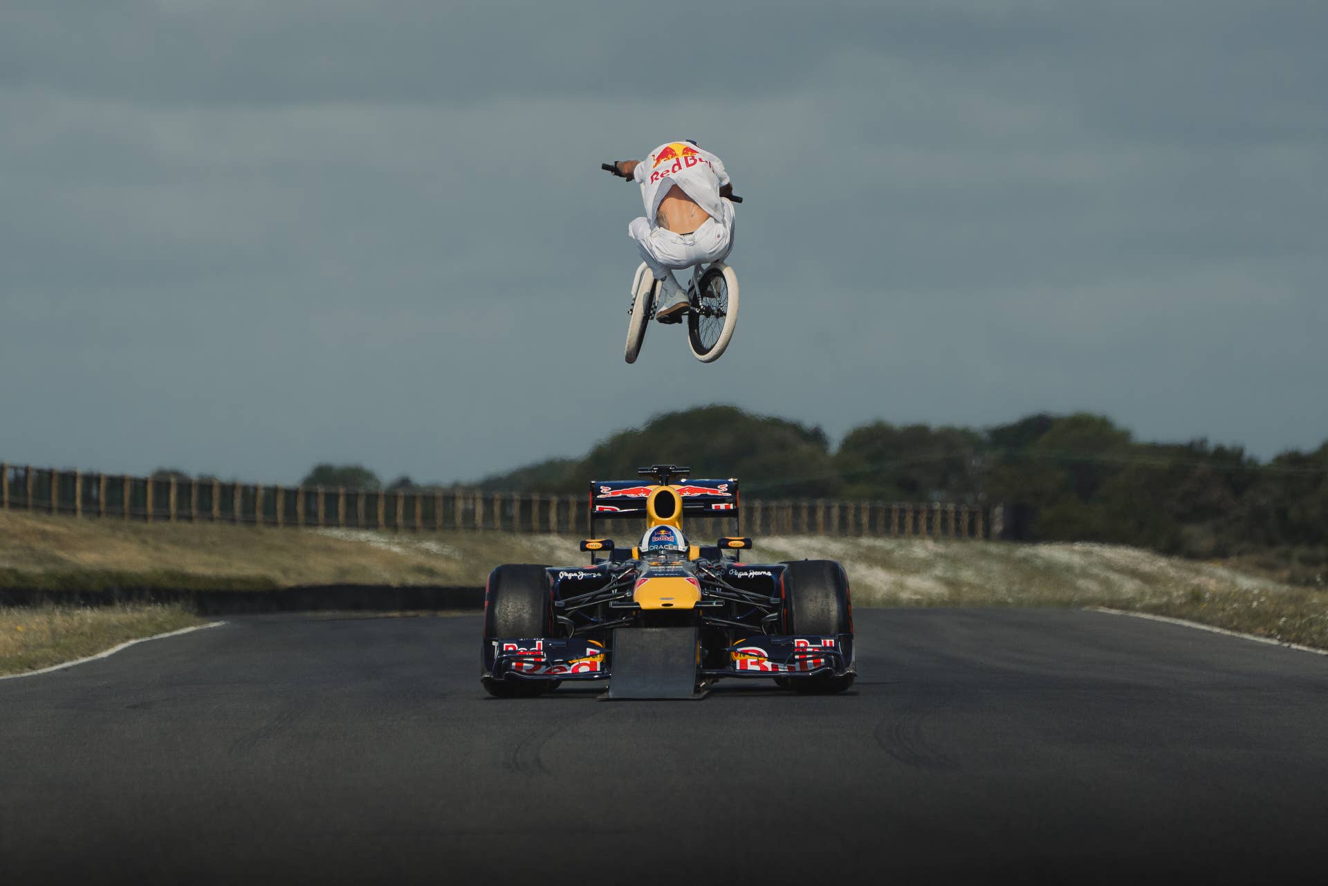 Watch Kriss Kyle Jump a Moving F1 Car - BikeMag